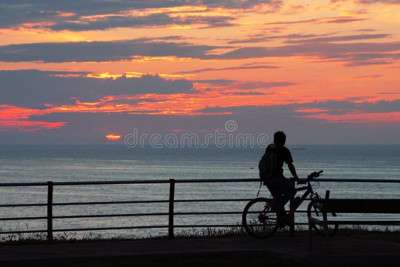 Biker Biking on Beach at Sunset with Bicycle Shadow Stock Image - Image ...