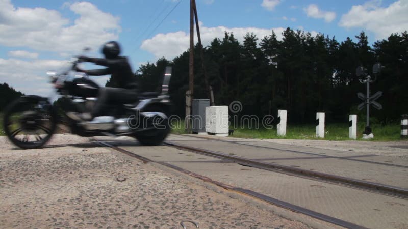 The Biker on a Motorcycle Moves the Railway Tracks Stock Footage ...