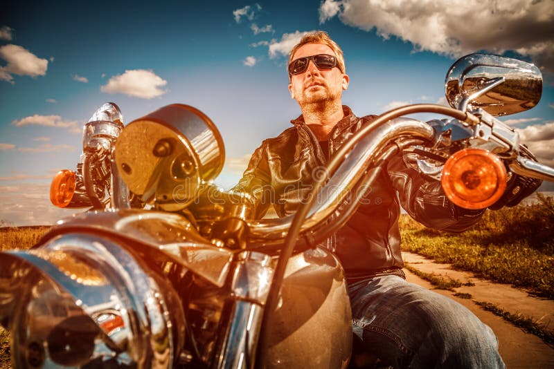 Biker on a motorcycle stock photo. Image of city, leather - 32416288