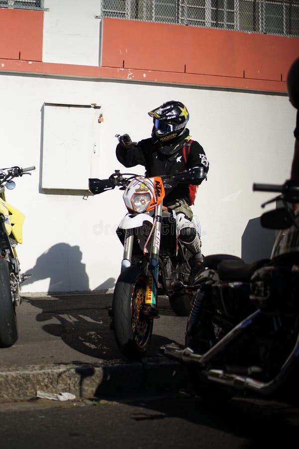 Biker on a Motorcycle Wearing a Black Jacket and Helmet. Editorial ...