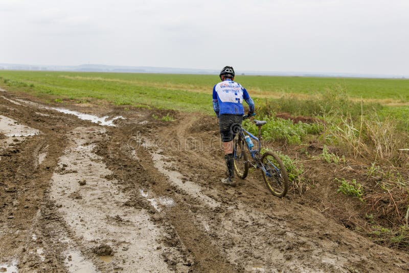 Off-road Biker on a Mud Road Editorial Photography - Image of athlete ...