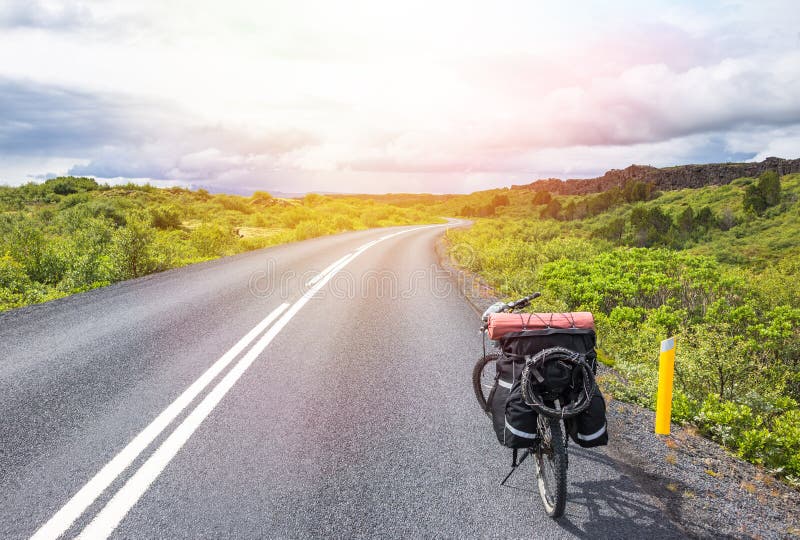 Biker Rides on Road at Sunny Summer Day in Iceland Stock Photo - Image ...