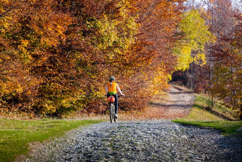 Biker Riding in Autumn Mountains Stock Image - Image of bicycle, active ...