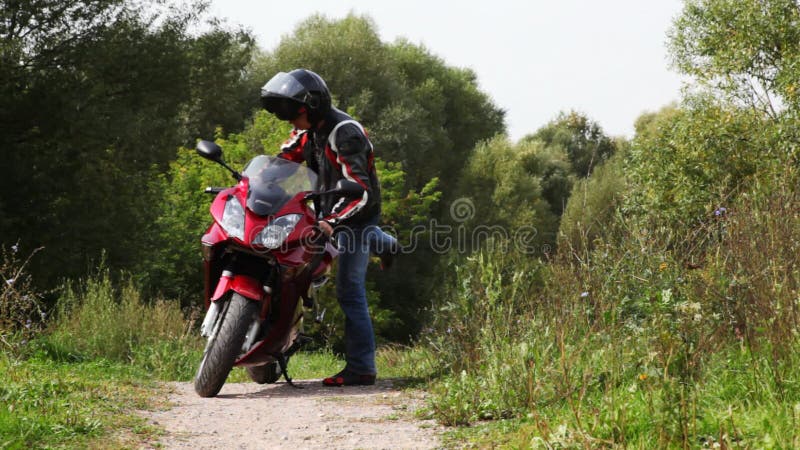 Biker Sit Down on Motorcycle and Close Visor on it Stock Video - Video ...