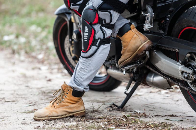 Biker Sitting on Motorcycle, Close-up View on Legs. Stock Photo - Image ...