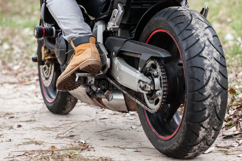 Biker Sitting on Motorcycle, Close-up View on Legs. Stock Photo - Image ...