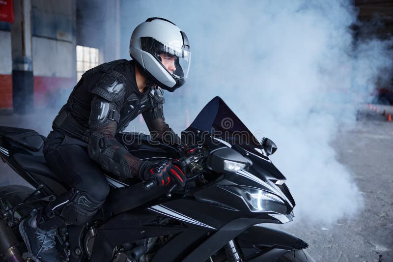 Biker Wearing Protective Helmet and Uniform for Speed Riding at ...
