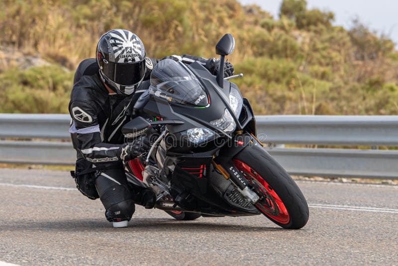 Bikers in the Foreground Circulating on the Public Road and with Rustic ...