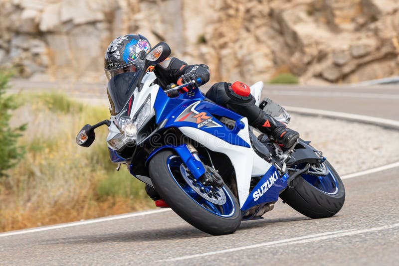 Bikers in the Foreground Circulating on the Public Road and with Rustic ...