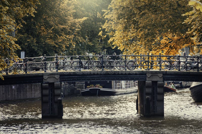 Bikes on a Bridge on a Canal in Amsterdam, Netherlands Stock Photo ...
