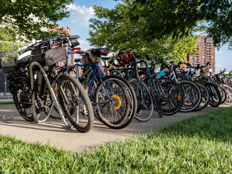 Bikes Lined Up on Bike Rack on a Sunny Day Stock Photo - Image of pedal ...