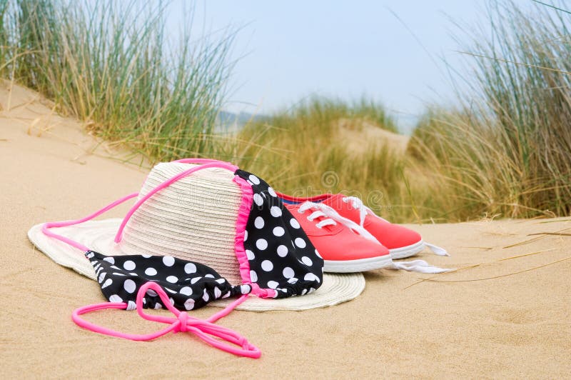 Bikini, Sun Hat and Shoes on Beach Stock Photo - Image of coastline ...