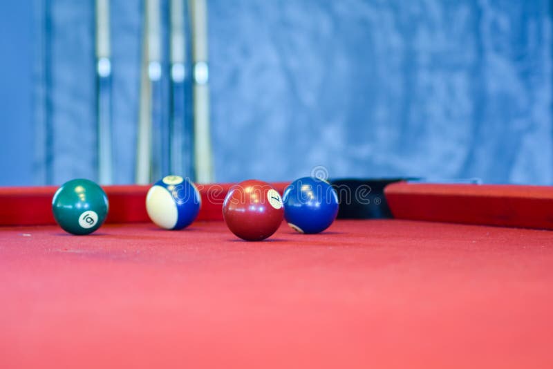 Billiard Balls on a Red Pool Table Stock Photo - Image of black, balls ...