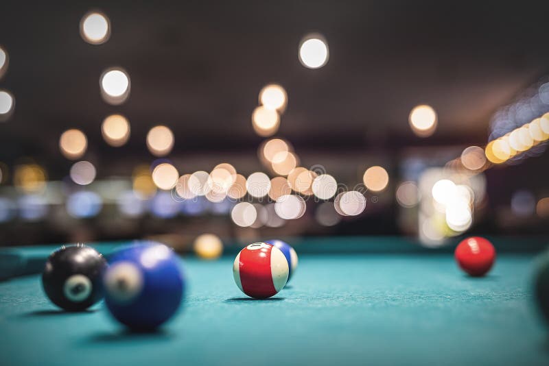 Billiard Colored Balls and Wooden Cue are Scattered on a Beautiful ... Billiard Colored Balls and Wooden Cue are Scattered on a Beautiful ...
