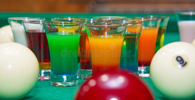 On a Billiard Table Stand with Coloured Glasses of Alcohol. Stock Image ...