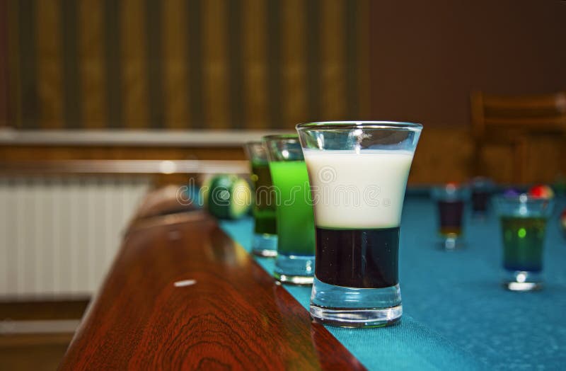 On a Billiard Table Stand with Coloured Glasses of Alcohol. Stock Image ...