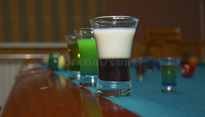 On a Billiard Table Stand with Coloured Glasses of Alcohol. Stock Image ...