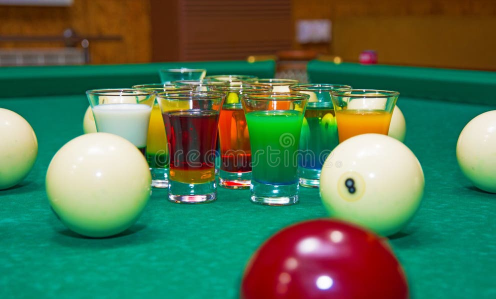 On a Billiard Table Stand with Coloured Glasses of Alcohol. Stock Photo ...