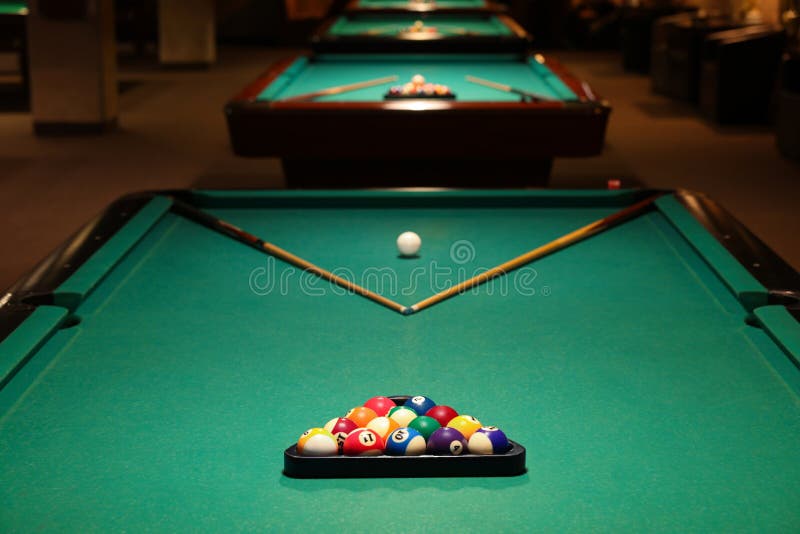 Billiard Tables with Balls and Cues in Club Stock Image - Image of ...