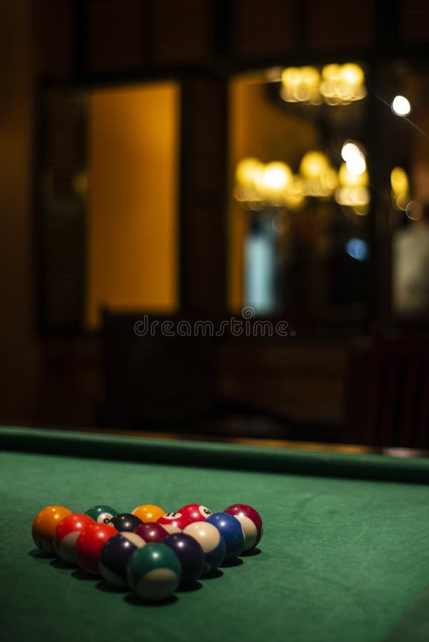 Billiards Balls on Pool Table in Cozy Dark Bar Interior Stock Image ...