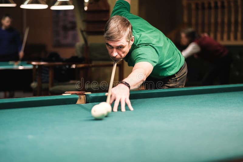 A Pool Player Takes Aim at the Ball Stock Photo - Image of ball, person ...