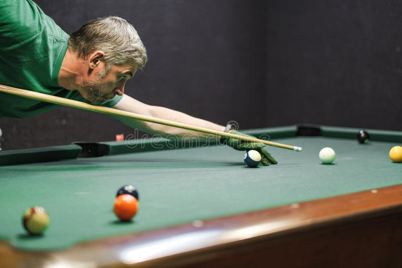 A Pool Player Takes Aim at the Ball Stock Image - Image of serious ...