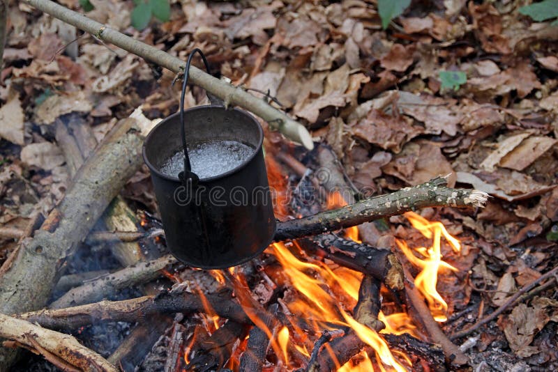Pouring Water On A Campfire