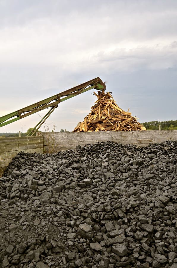 Bin of Coal and Stack Scrap Lumber Stock Photo - Image of piled ...