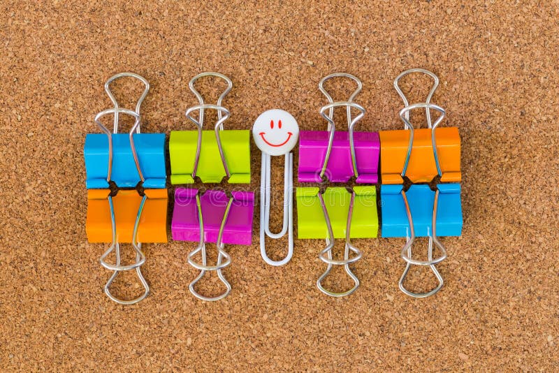 Binder clips on cork board stock image. Image of foldover - 93868581