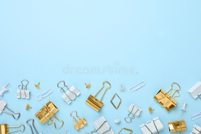 Binder Clips on Light Blue Background, Flat Lay. Space for Text Stock ...