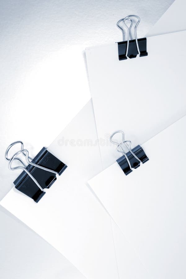 Binder clips on paperwork stock image. Image of office - 2476287