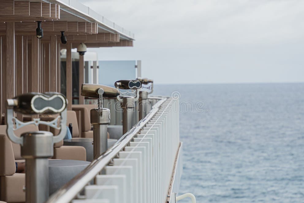 Binoculars on Ship Desk Viewing a Cruise Ship Stock Image - Image of ...