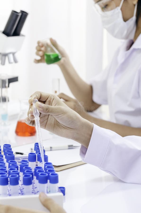 Technicians Analyzing Sample in Medical Lab Stock Photo - Image of male ...