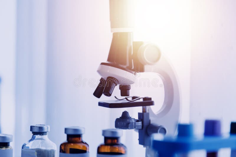 Biochemical Research Scientist Team Working with Microscope for ...