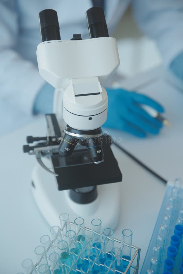 Biochemical Research Scientist Team Working with Microscope for ...