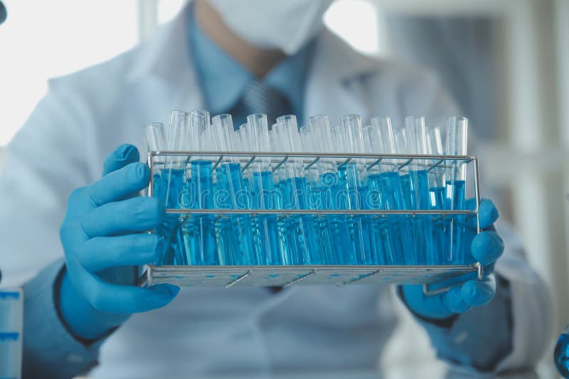 Biochemical Research Scientist Team Working with Microscope for ...