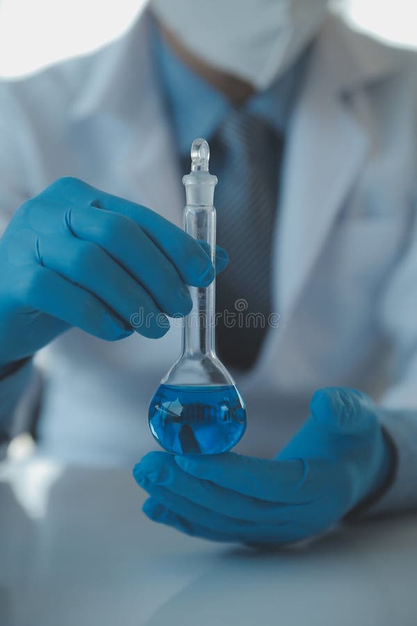 Biochemical Research Scientist Team Working with Microscope for ...