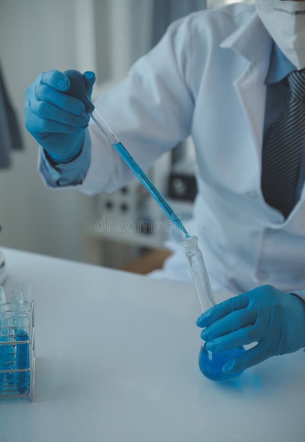 Biochemical Research Scientist Team Working with Microscope for ...