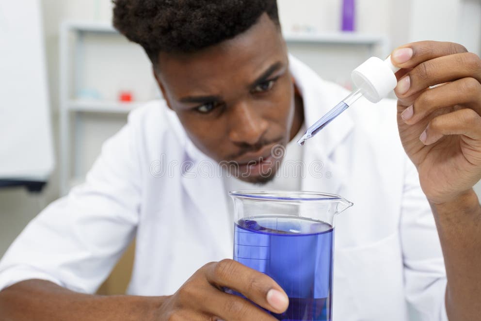 Biochemist with Flask at Desk Stock Image - Image of chemical ...