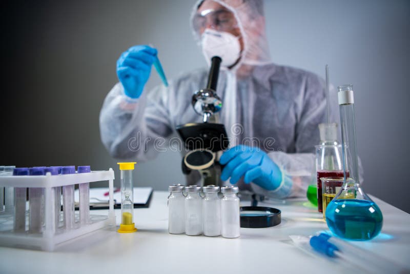 Biochemistry Laboratory Research, Chemist in Protective Suit Analyzing ...
