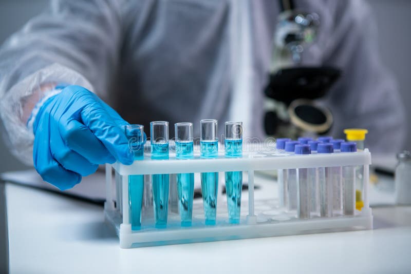 Biochemistry Laboratory Research, Chemist in Protective Suit Analyzing ...