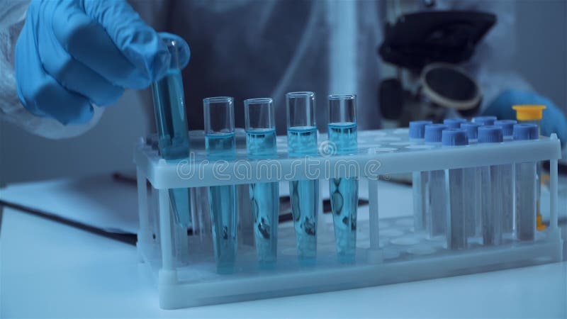 Biochemistry Laboratory Research, Chemist in Protective Suit Analyzing ...