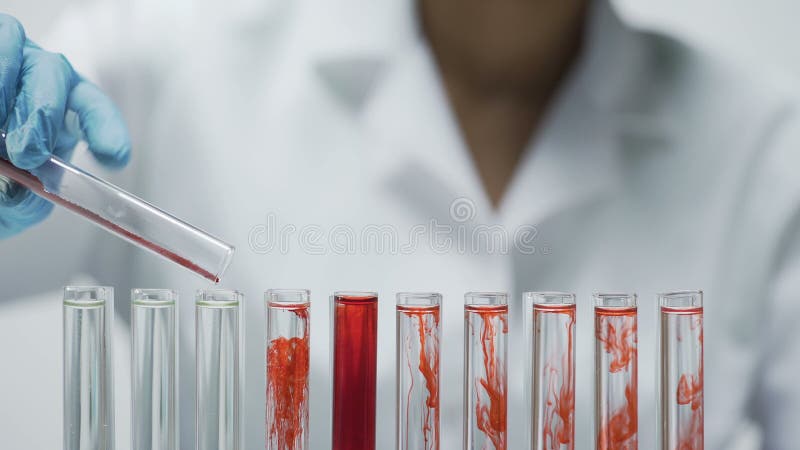 Biochemistry Student Conducting Research with Test Material in ...