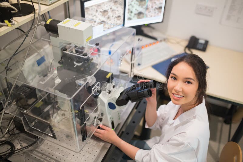 Biochemistry Student Using Large Microscope and Computer Stock Image ...