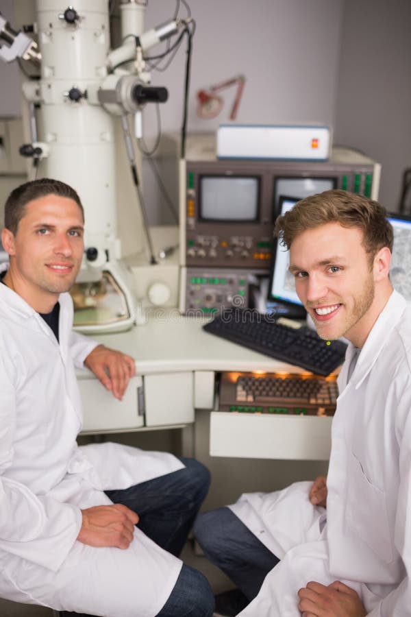 Biochemistry Student Using Large Microscope and Computer Stock Image ...