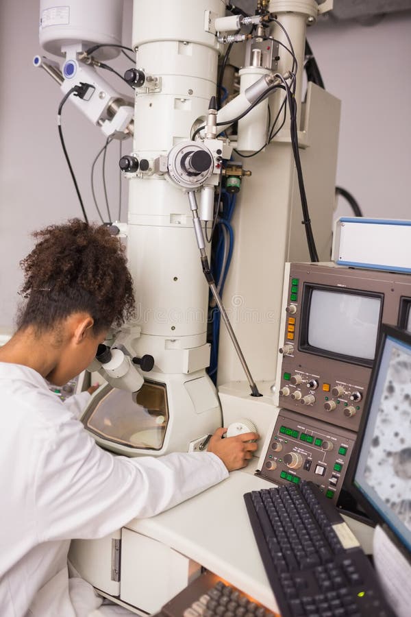 Biochemistry Students Using Large Microscope and Computer Stock Image ...