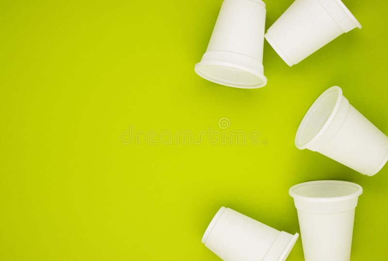 Biodegradable Beverage Containers on a Green Background, Space for Text ...