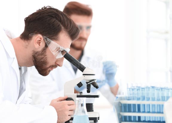 Biologist Explores the Substance Under the Microscope Stock Image ...