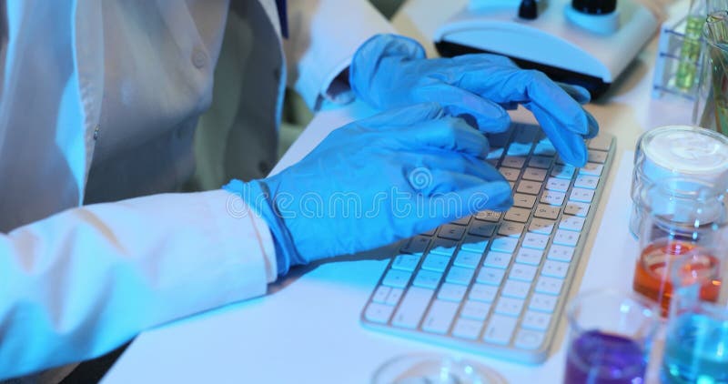 Biologist Scientist Typing on Computer Keyboard in Laboratory Research ...