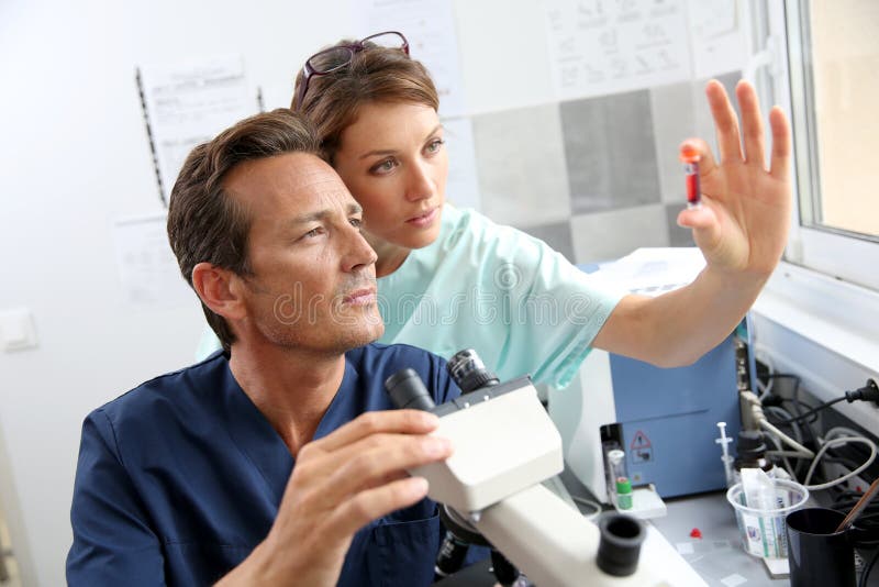 Biologists Checking Samples in Laboratory Stock Photo - Image of people ...